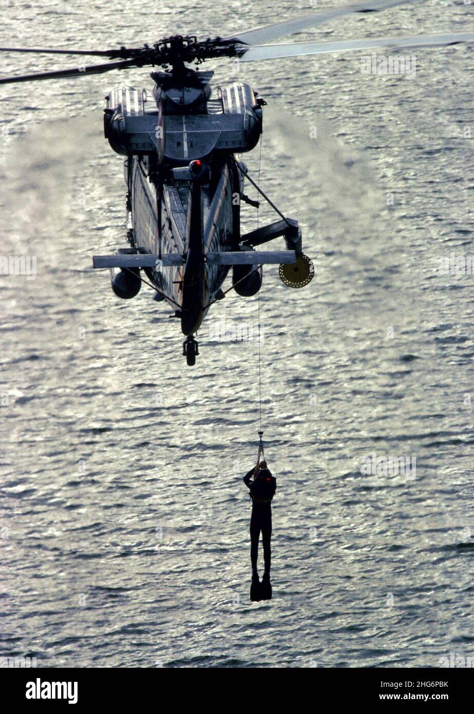 SH-2F Seasprite hoists SAR swimmer Stock Photo - Alamy