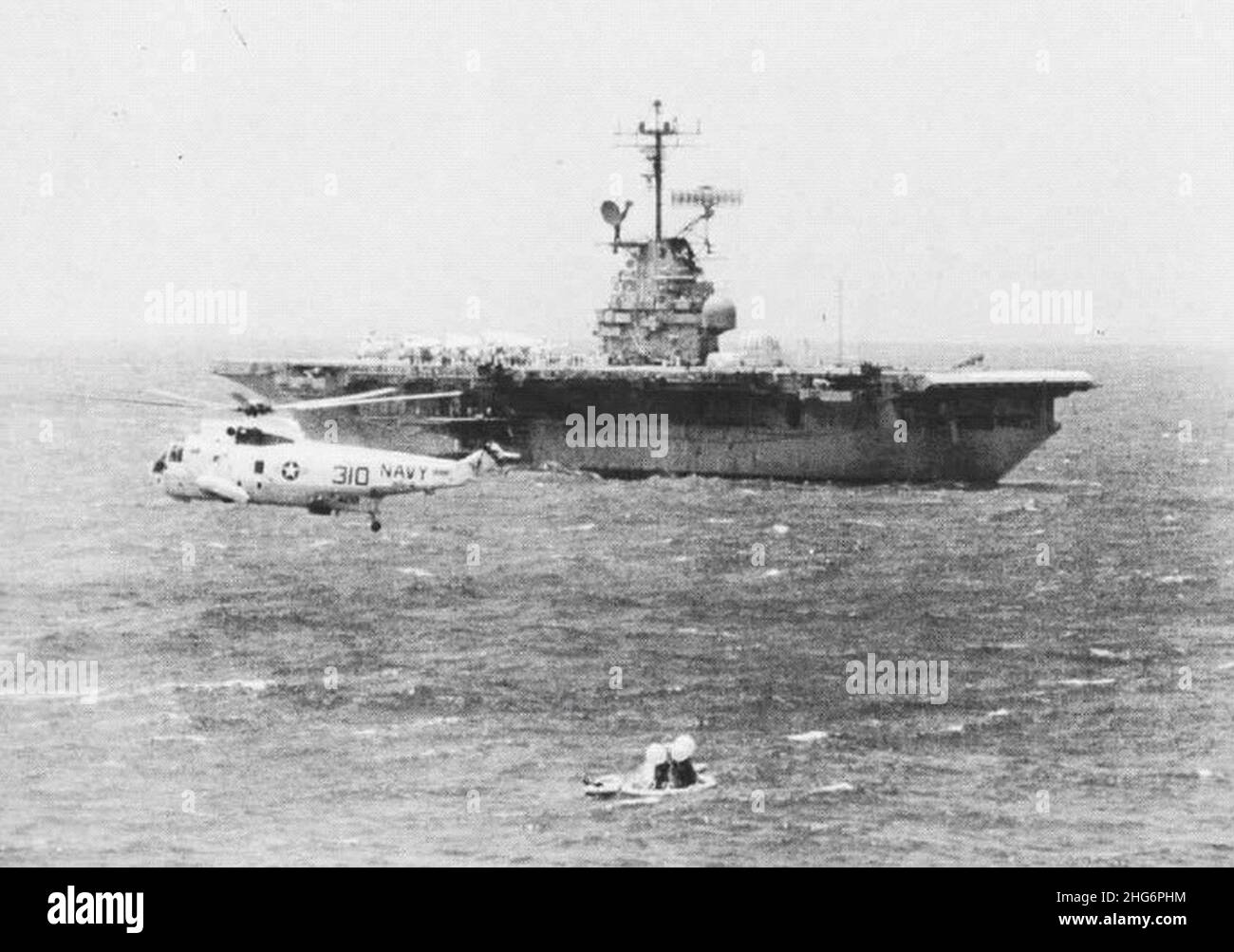 SH-3D of HS-4 flies over Apollo 12 command module near USS Hornet (CVS ...