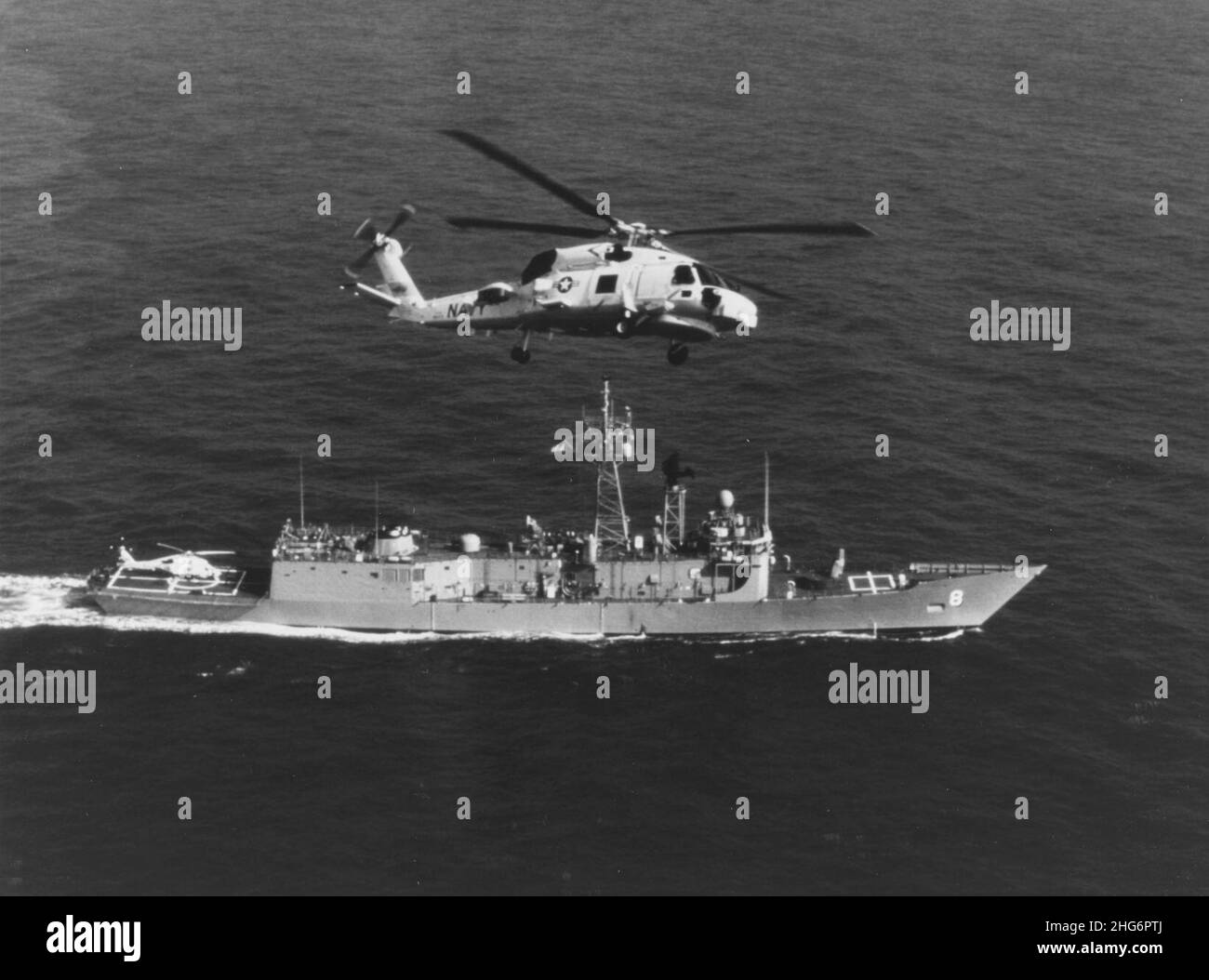 SH-60B Seahawk in flight over USS McInerney (FFG-8) in March 1981 Stock ...