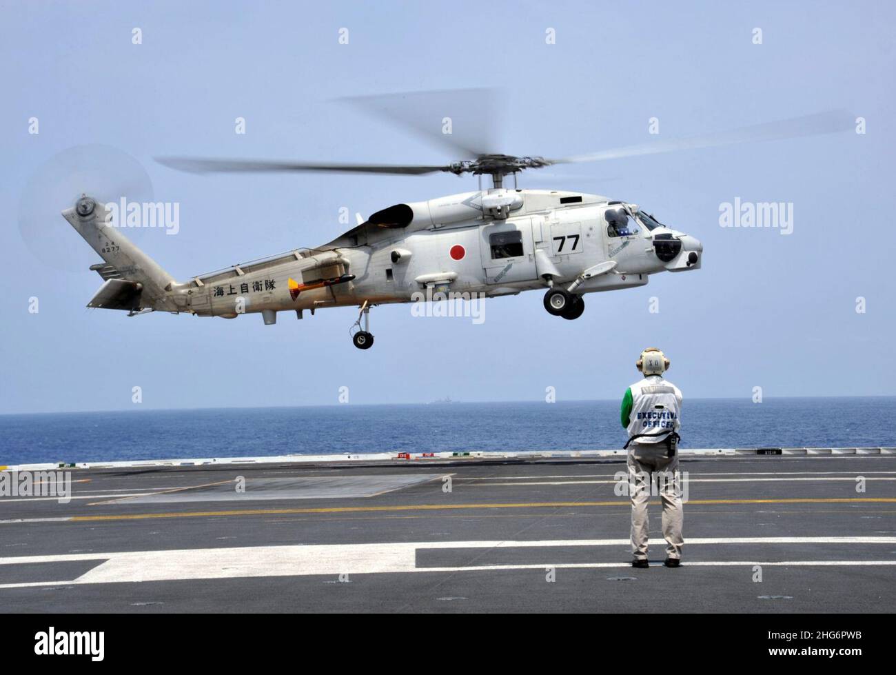 SH-60J (24-8277) of JMSDF lands on the flight deck of USS George ...