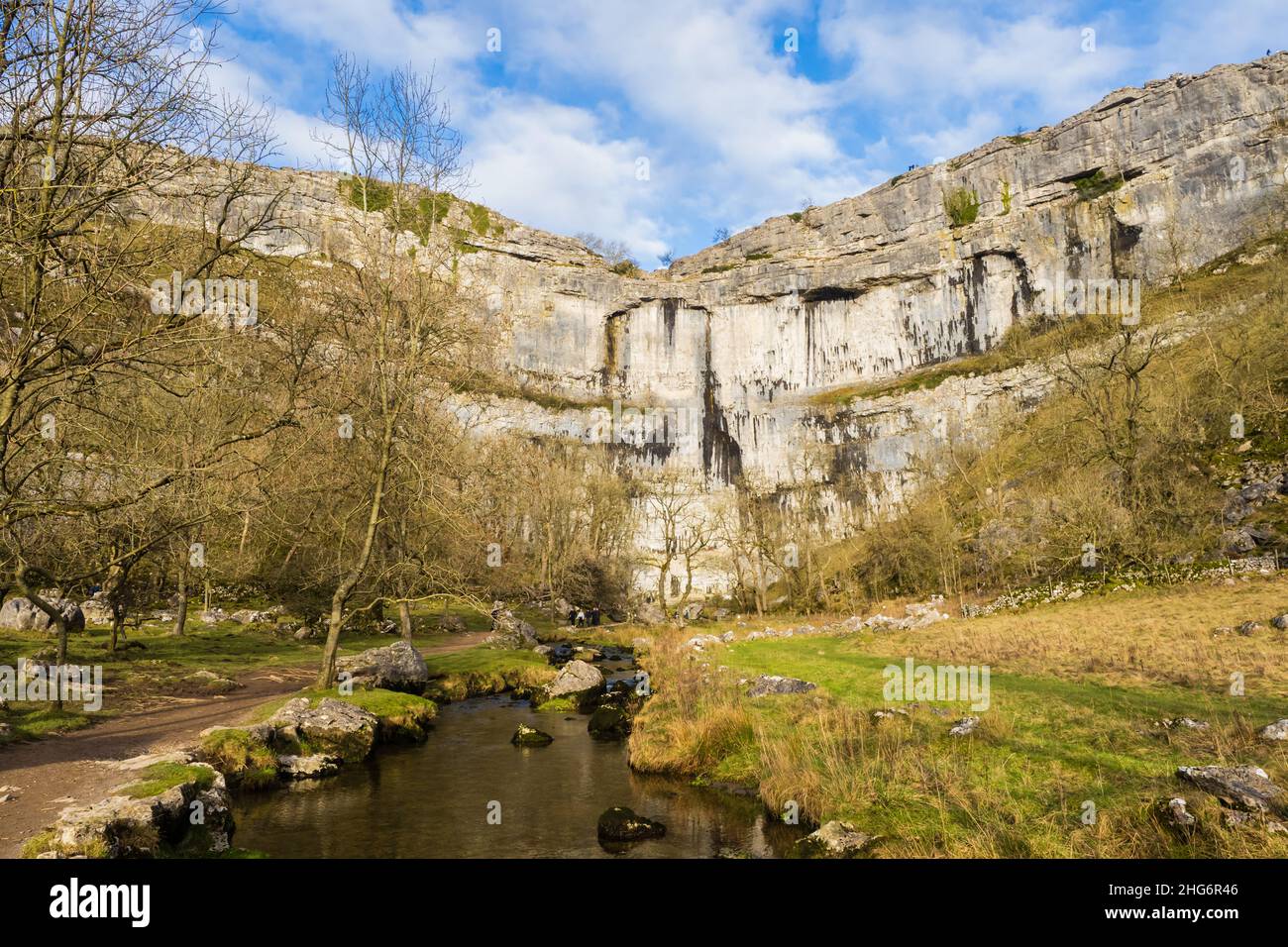 Malham Cove is a huge curving amphitheatre shaped cliff formation of ...