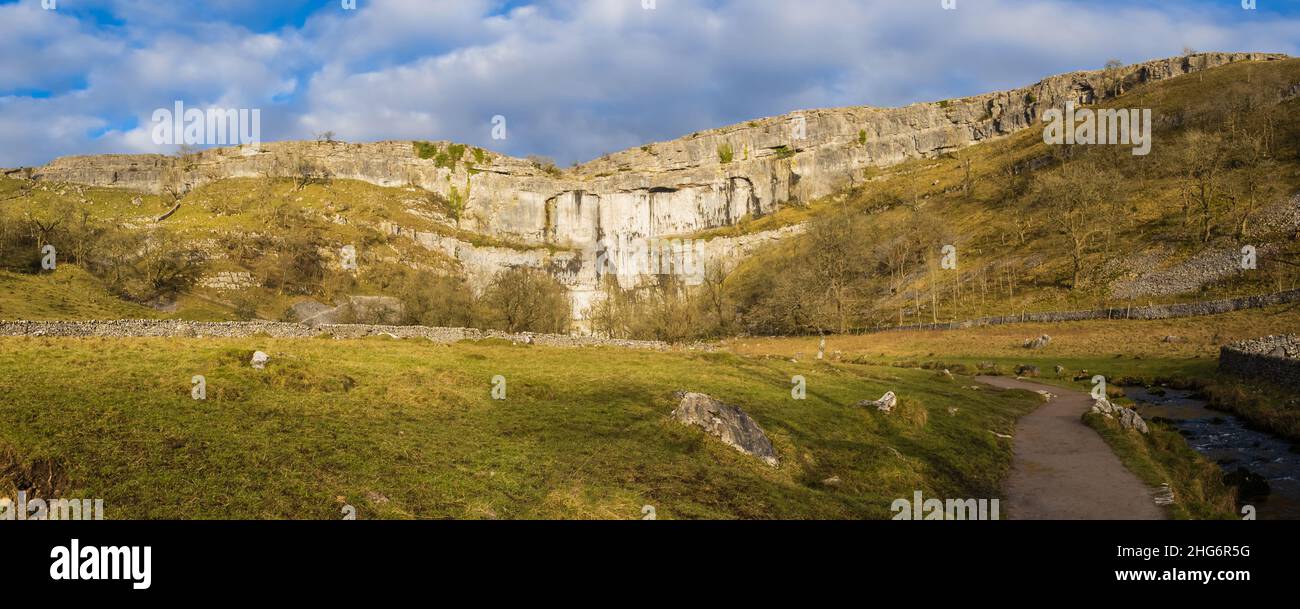 Malham Cove is a huge curving amphitheatre shaped cliff formation of ...