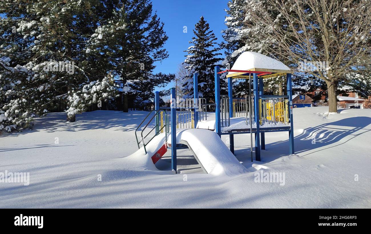 Winter recreation zone for children. Snowy weather. Slide - Kids play ...