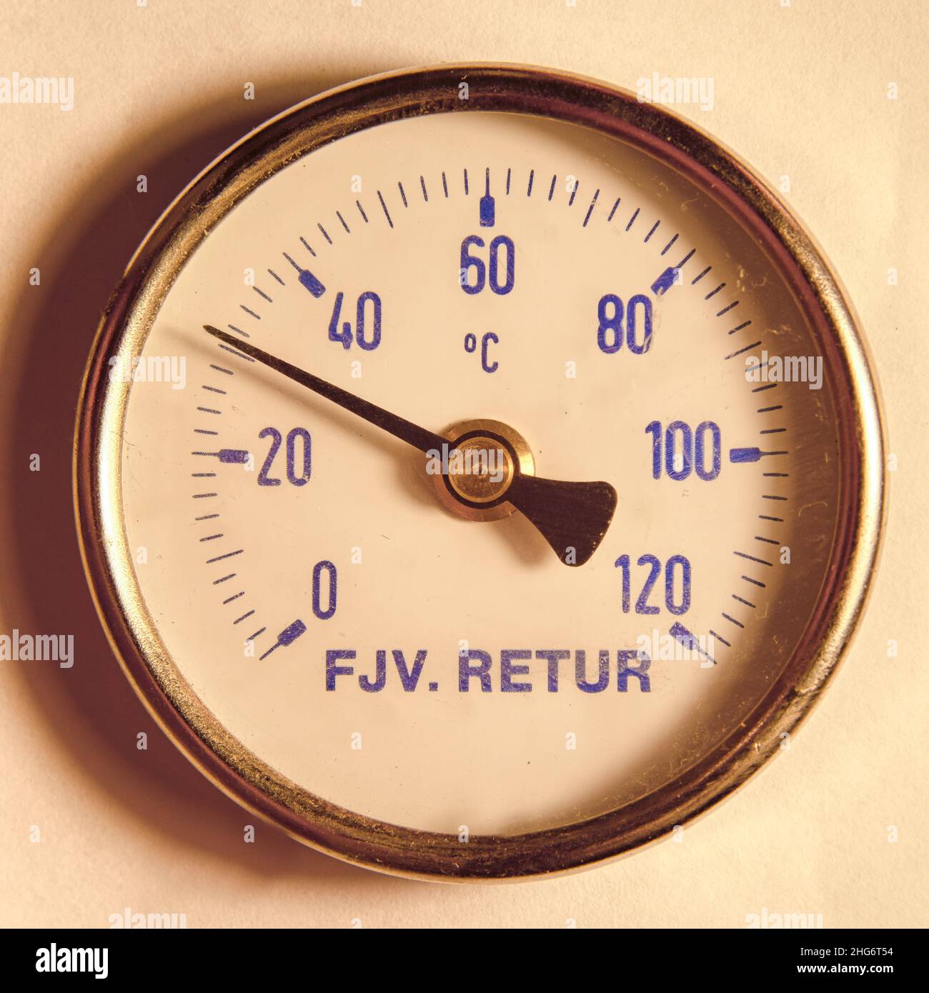 a round temperature meter on the returning water to a district heating ...