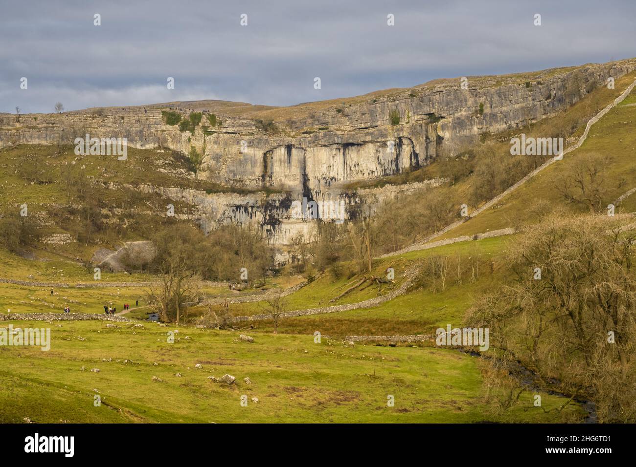 Malham Cove is a huge curving amphitheatre shaped cliff formation of ...