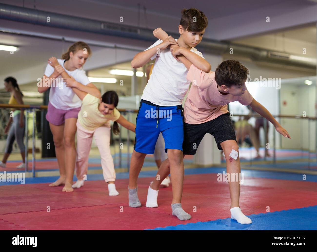 Two boys practicing self-defense moves Stock Photo - Alamy