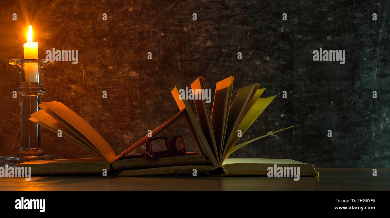 Reading books by candle light hi-res stock photography and images - Alamy