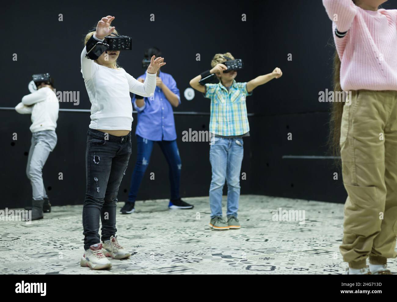 Children are looking for way out of virtual escape room Stock Photo - Alamy