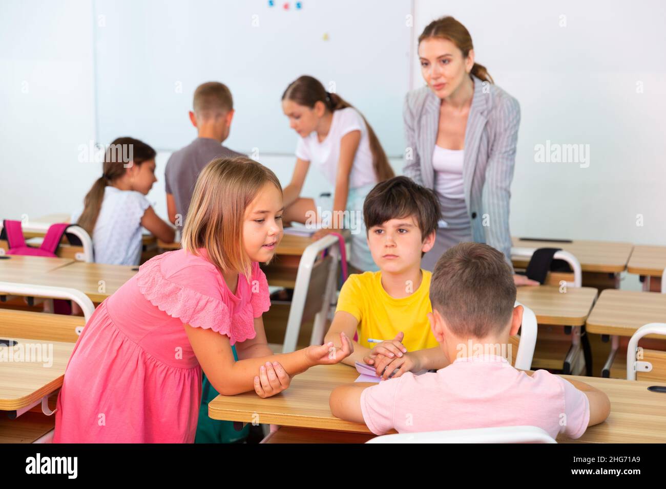 Children performing group tasks Stock Photo - Alamy