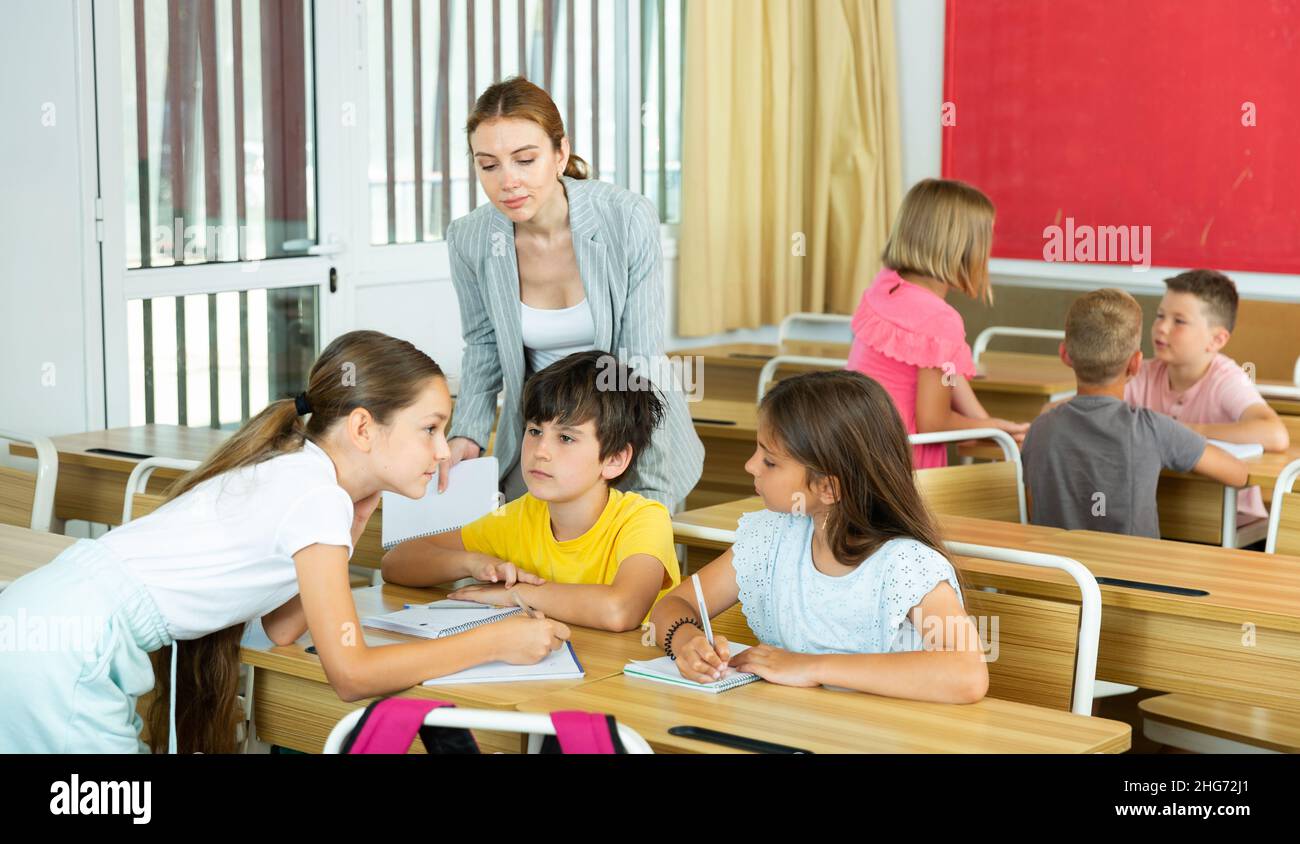 Children performing group tasks Stock Photo - Alamy