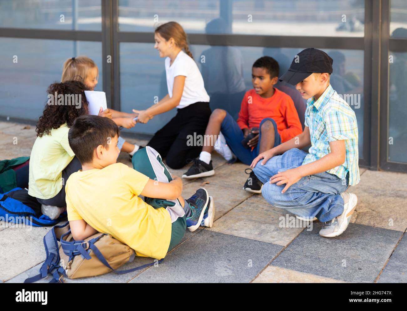 Group of children playing near school Stock Photo - Alamy
