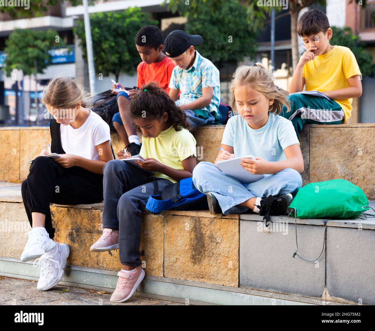 Group of kids having open air lesson Stock Photo - Alamy
