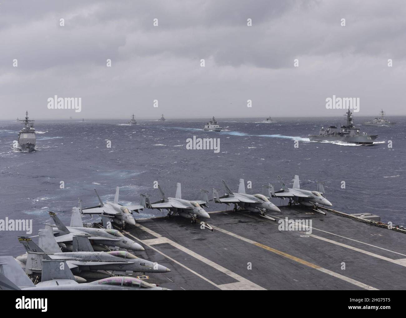 Ships from the Indian Navy, JMSDF, and the U.S. Navy sail in formation ...
