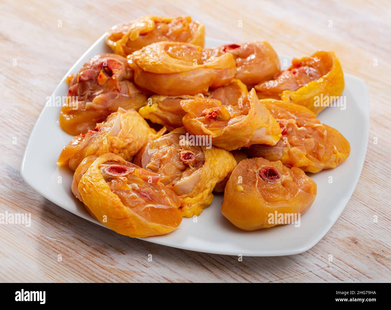 Raw sliced transversely chicken legs Stock Photo - Alamy