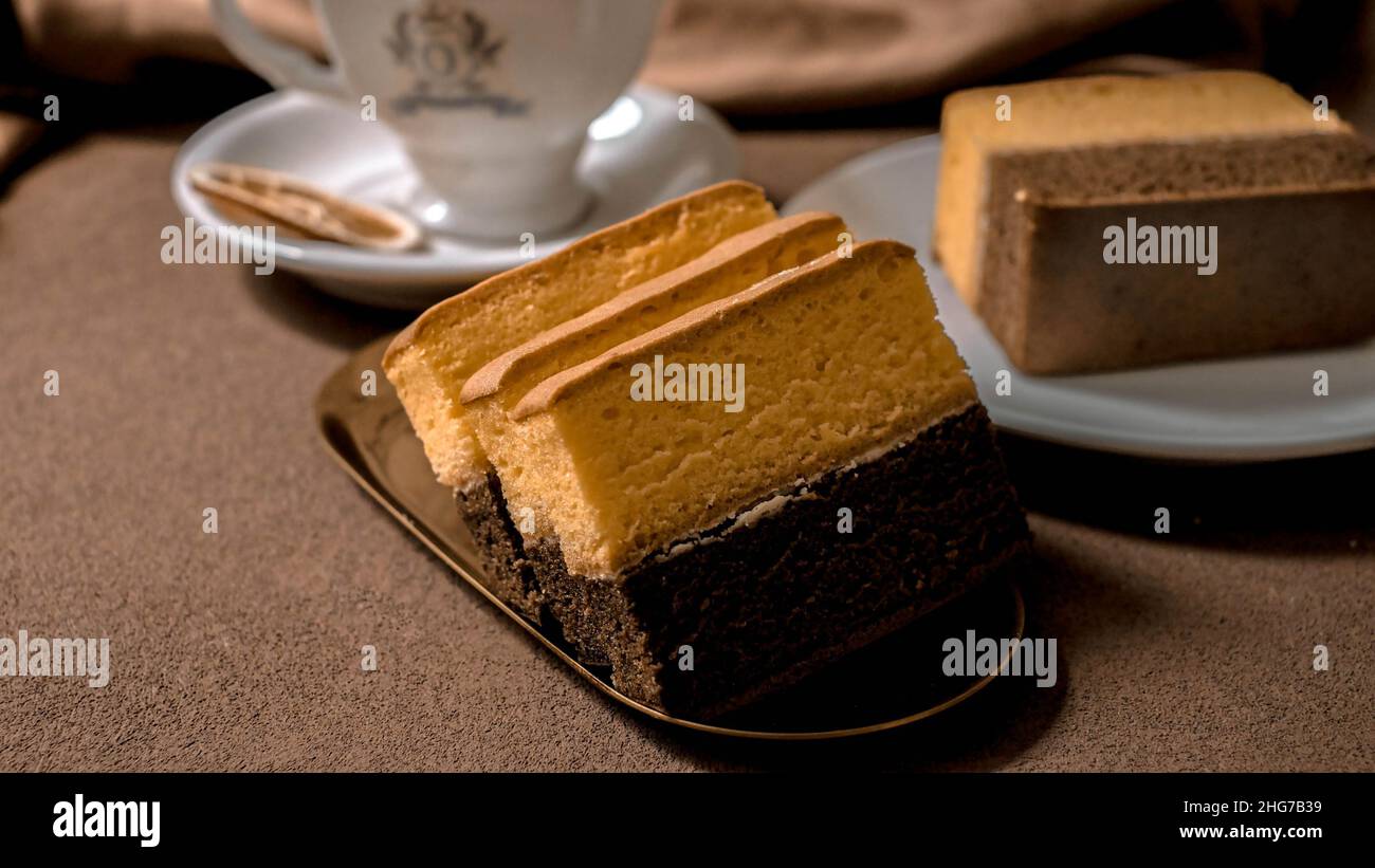a dessert in the form of a piece of brownie cake served on the table ...