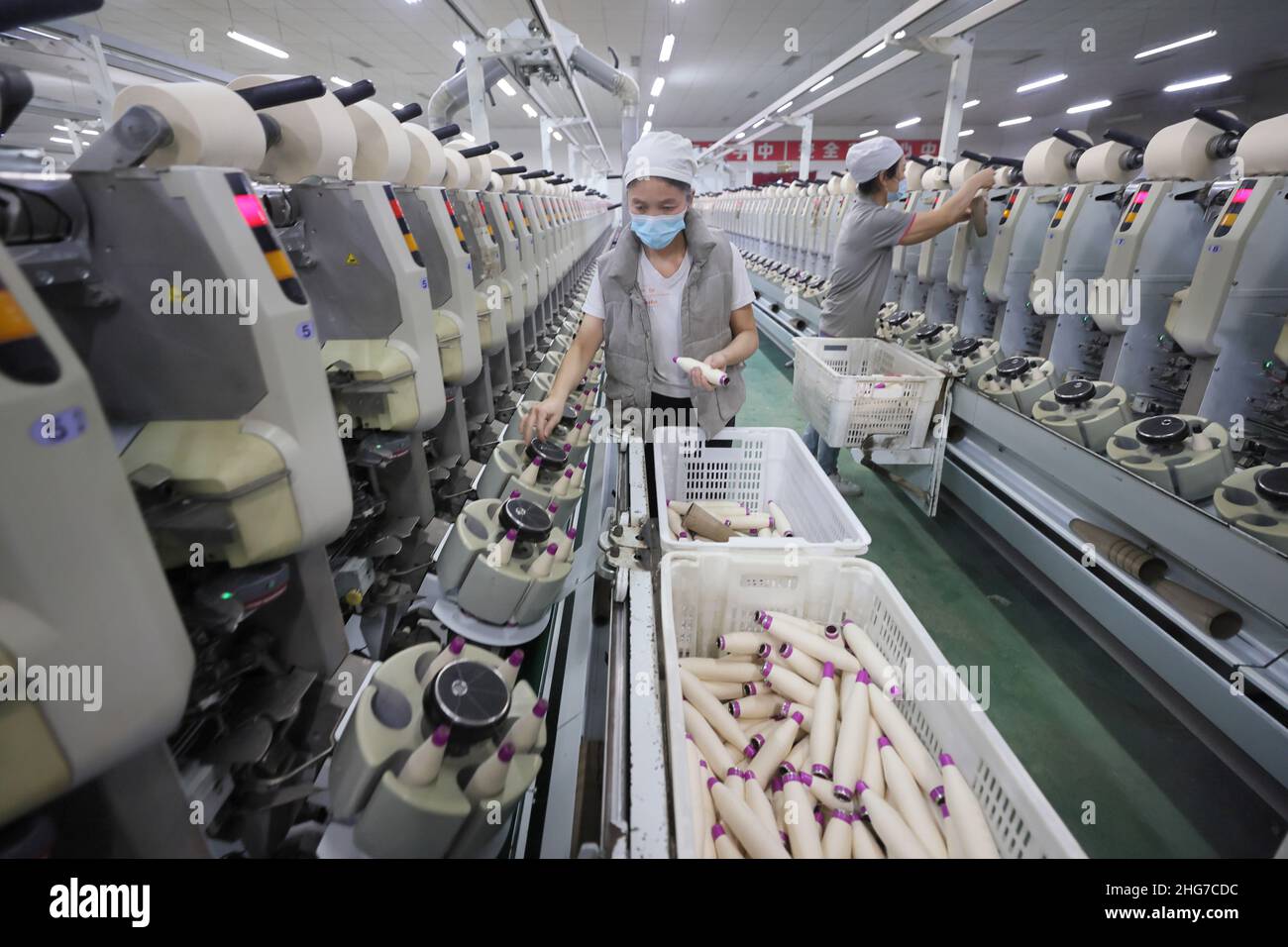 YUNCHENG, CHINA - JANUARY 18, 2022 - A worker operates at a spinning ...