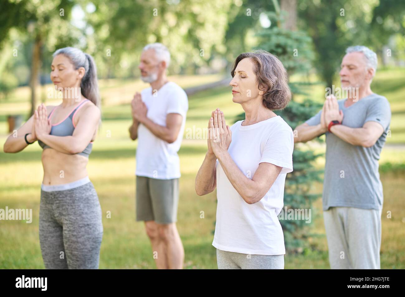 Group of people meditating hi-res stock photography and images - Alamy