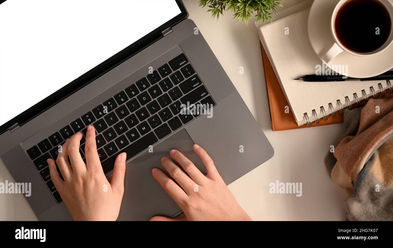 Overhead shot of female university student doing homework with blank ...