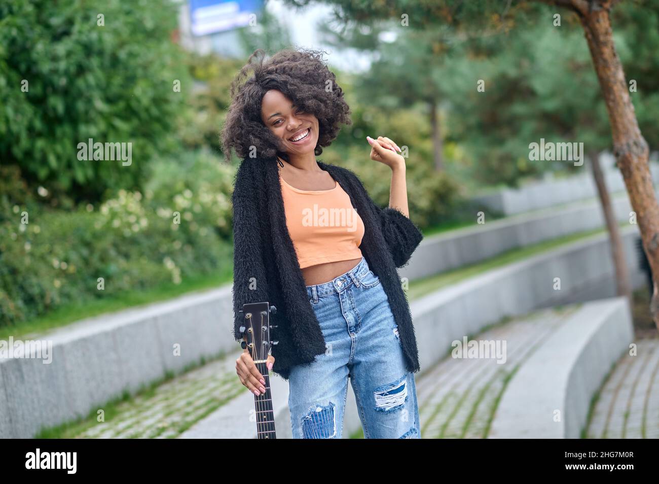 Touching guitar hi-res stock photography and images - Alamy