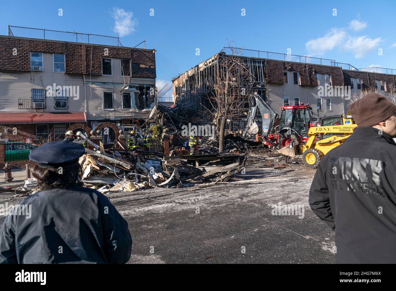 New York, NY - January 18, 2022: Firefighters work on raw houses ...