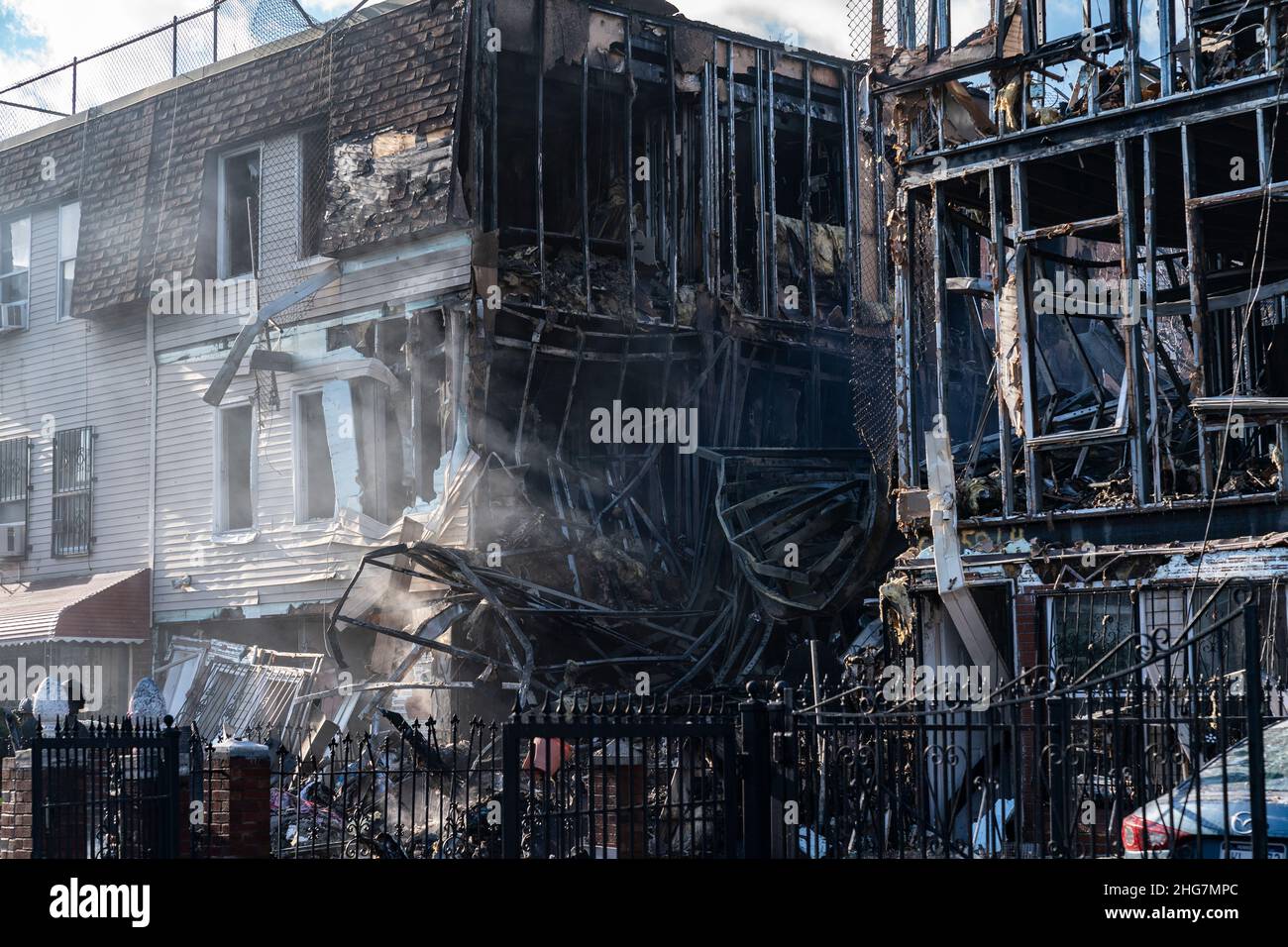 New York, NY - January 18, 2022: Firefighters work on raw houses ...