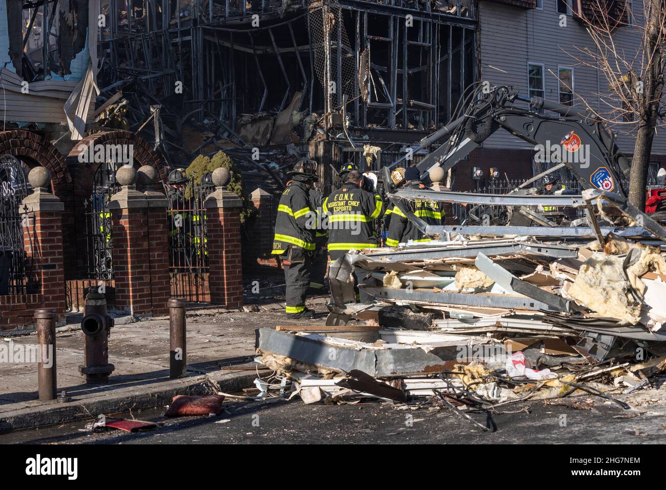 New York, NY - January 18, 2022: Firefighters work on raw houses ...