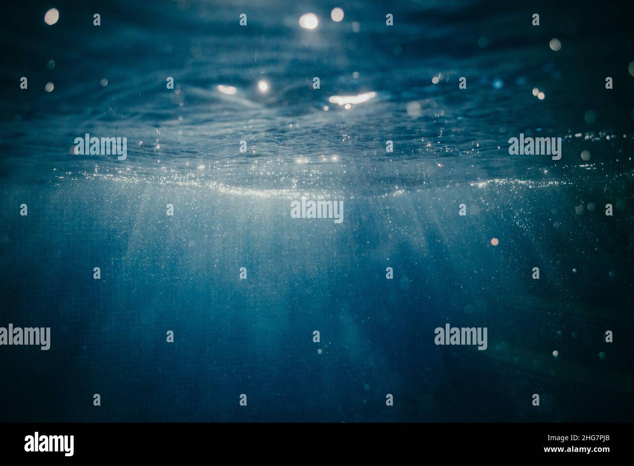 Light Rays Shimmer in Blue Pool Water Stock Photo - Alamy