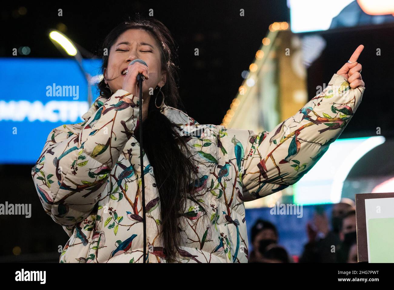 Janet Noh performs a song at a candlelight vigil for Michelle Alyssa Go ...