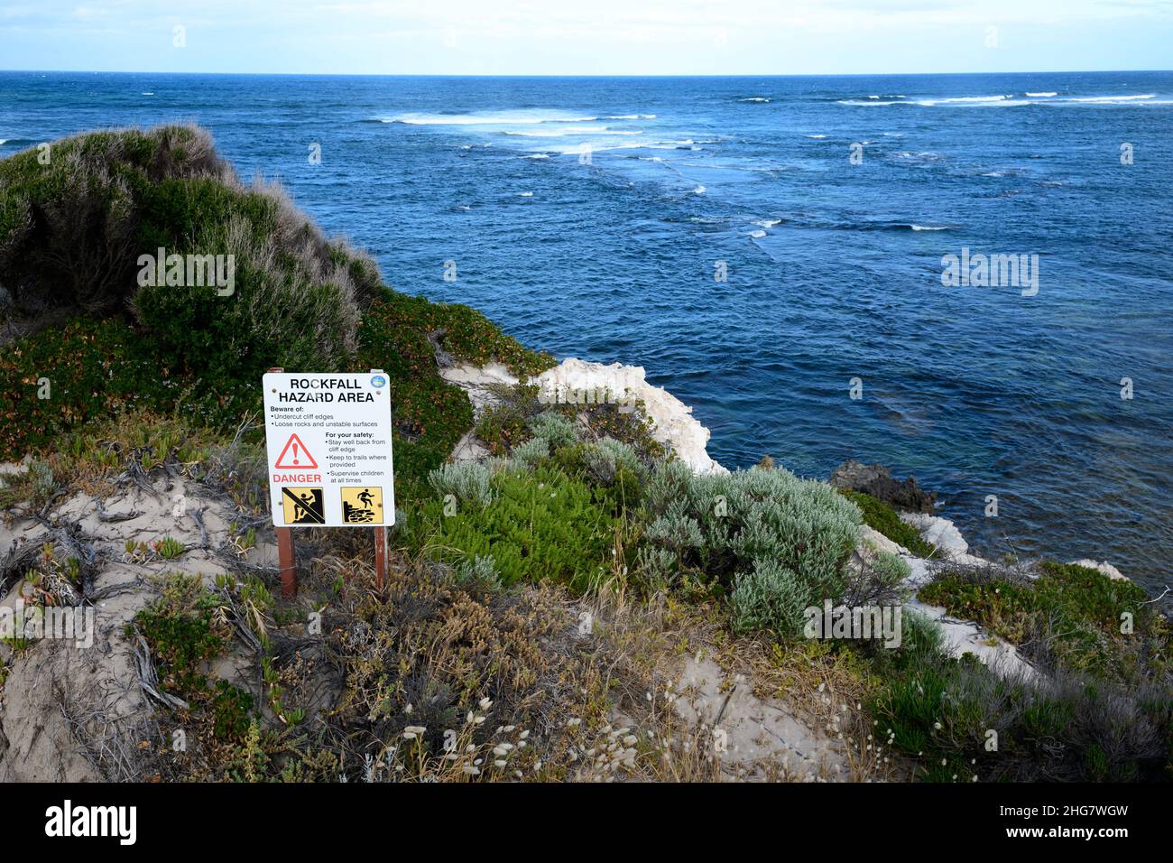 Signs warning of "Rockfall Hazard Area" on cliffs overlooking Gnarabup ...