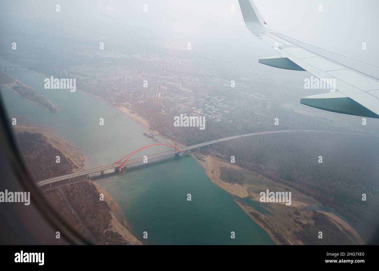 The view of Bugrinsky bridge over the Ob river from the airplane window ...
