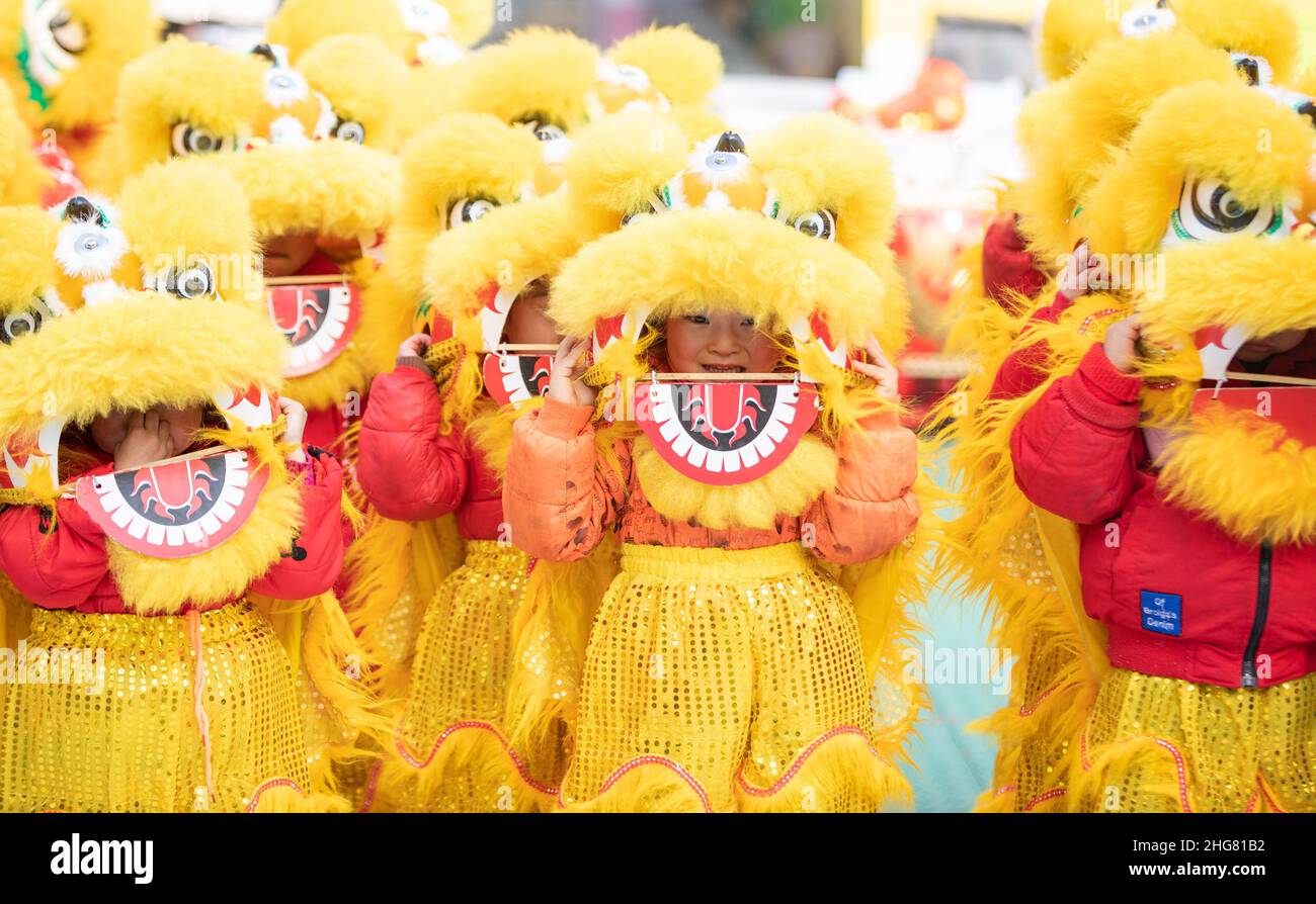HAI'AN, CHINA - JANUARY 19, 2022 - Kindergarten children perform a lion ...