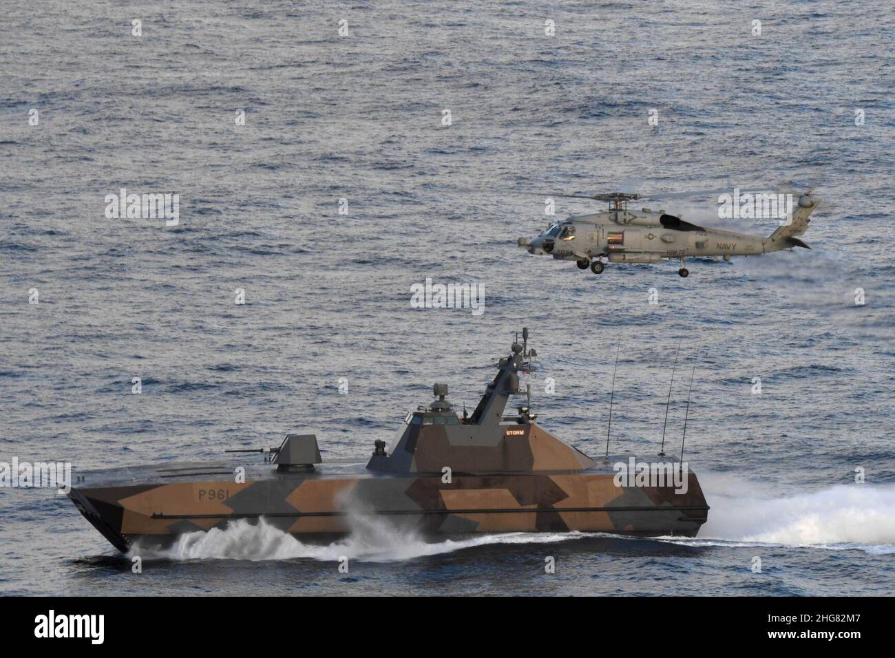 Sikorsky MH-60R Seahawk of HSM-72 flies over Norwegian patrol ship KNM ...