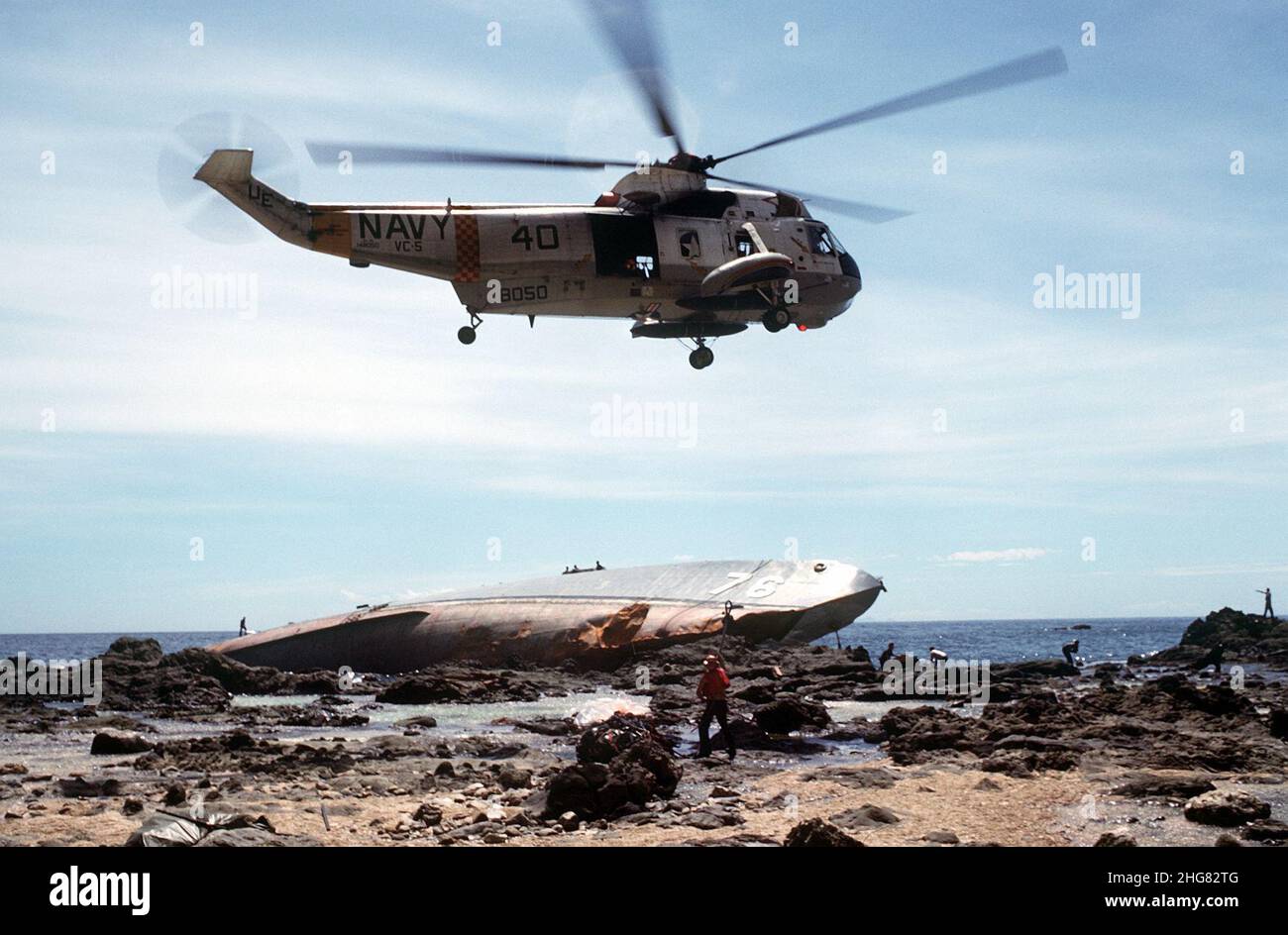 Sikorsky SH-3G Sea King of VC-5 flies over caspsized Philippine frigate ...