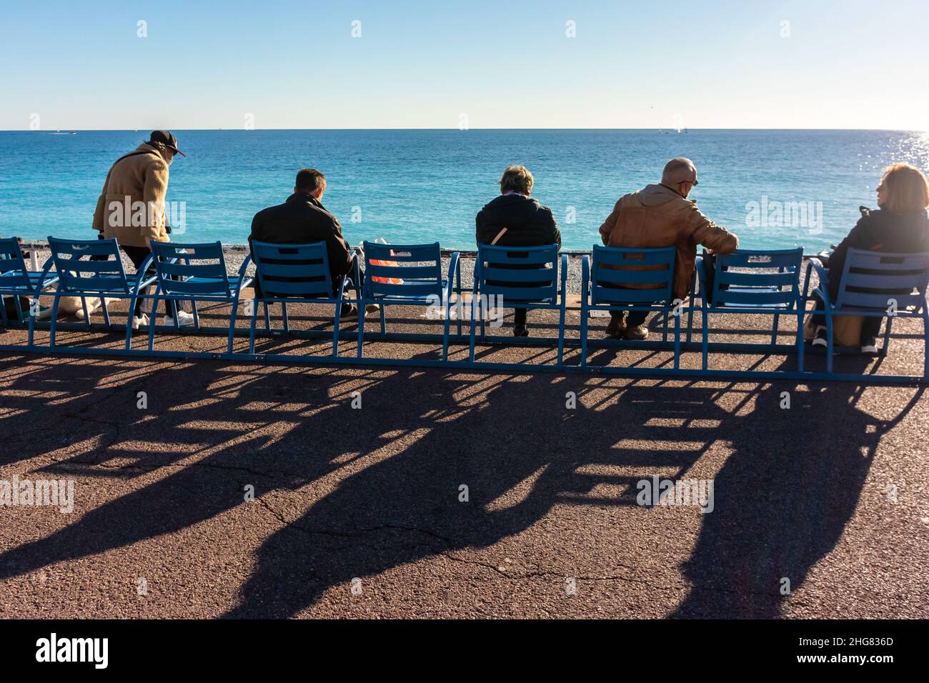 Silhouette seniors relaxing on beach hi-res stock photography and ...