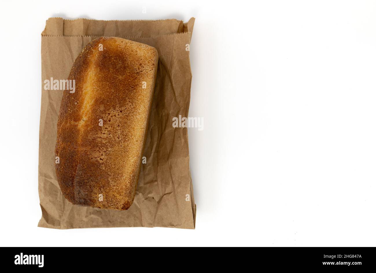 loaf of golden wheat bread brick isolated on white background, homemade ...