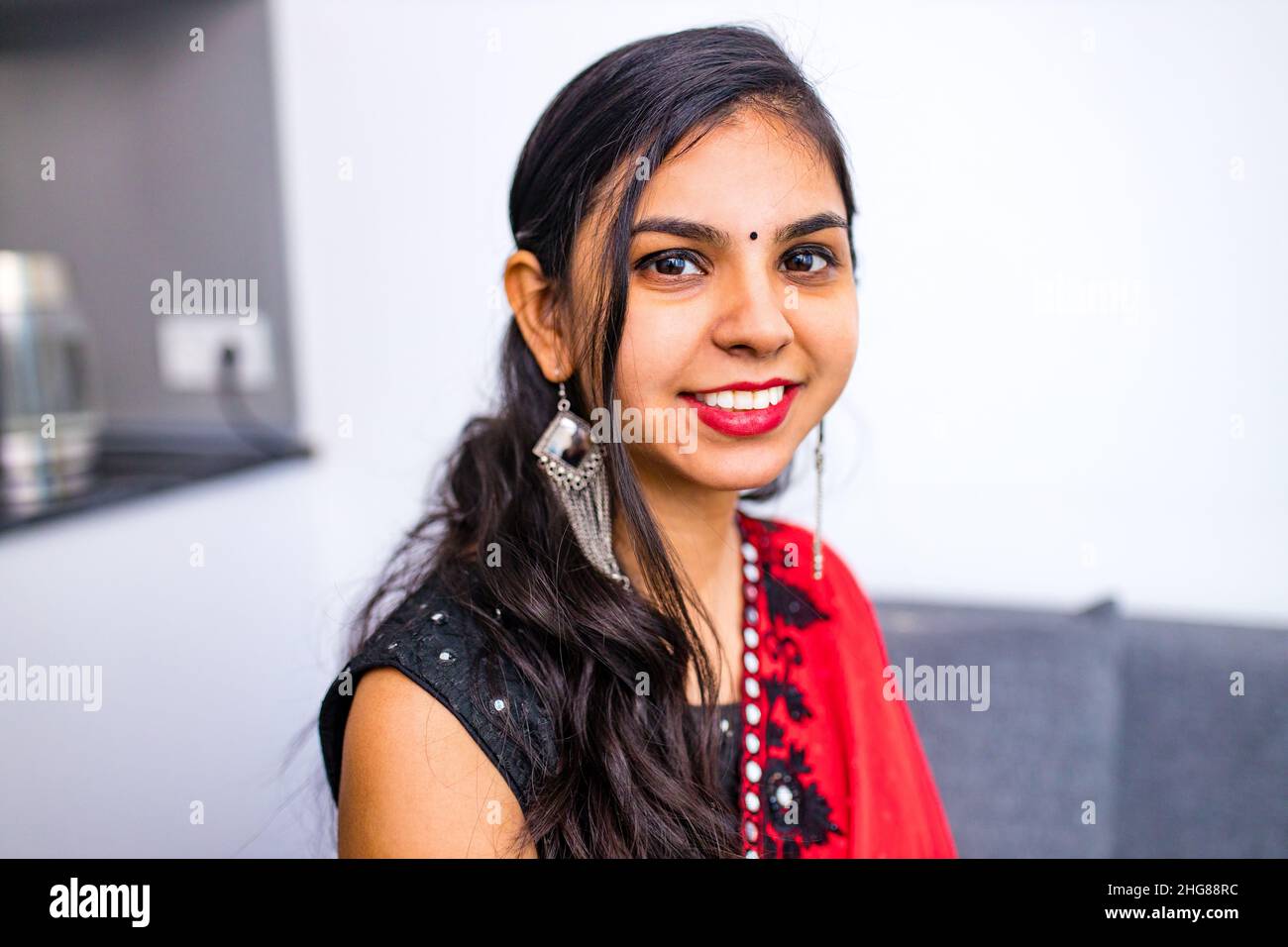 Beautiful Indian woman in traditional sari dress looking at camera ...