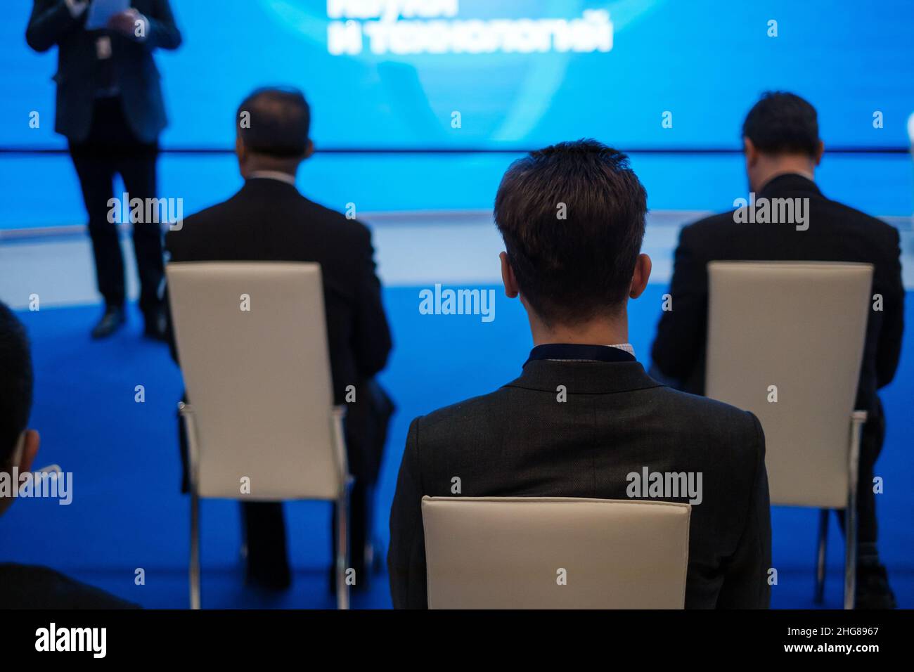 Businessmen in suits in conference hall Stock Photo - Alamy