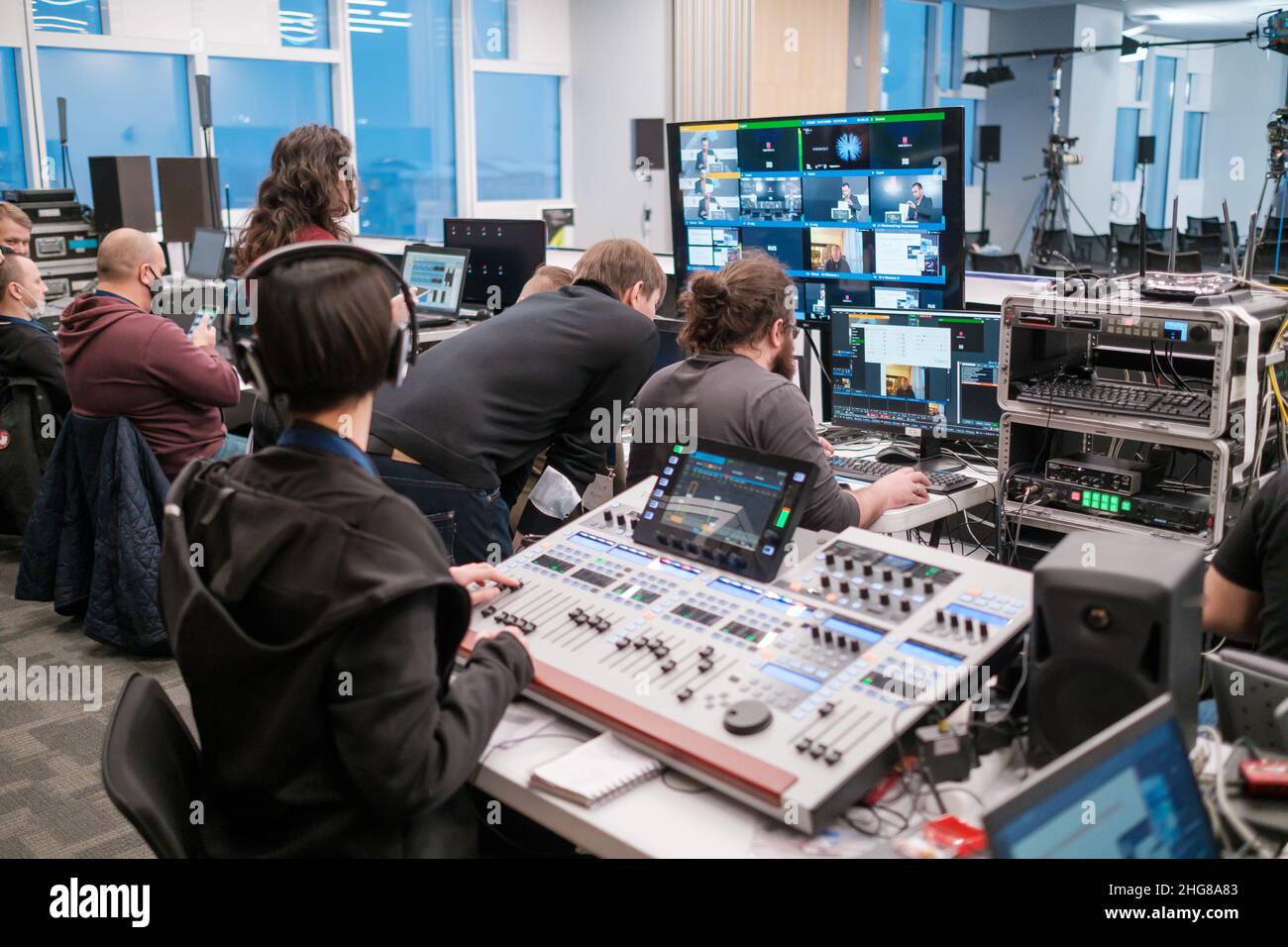Broadcast technicians work at computer hi-res stock photography and ...