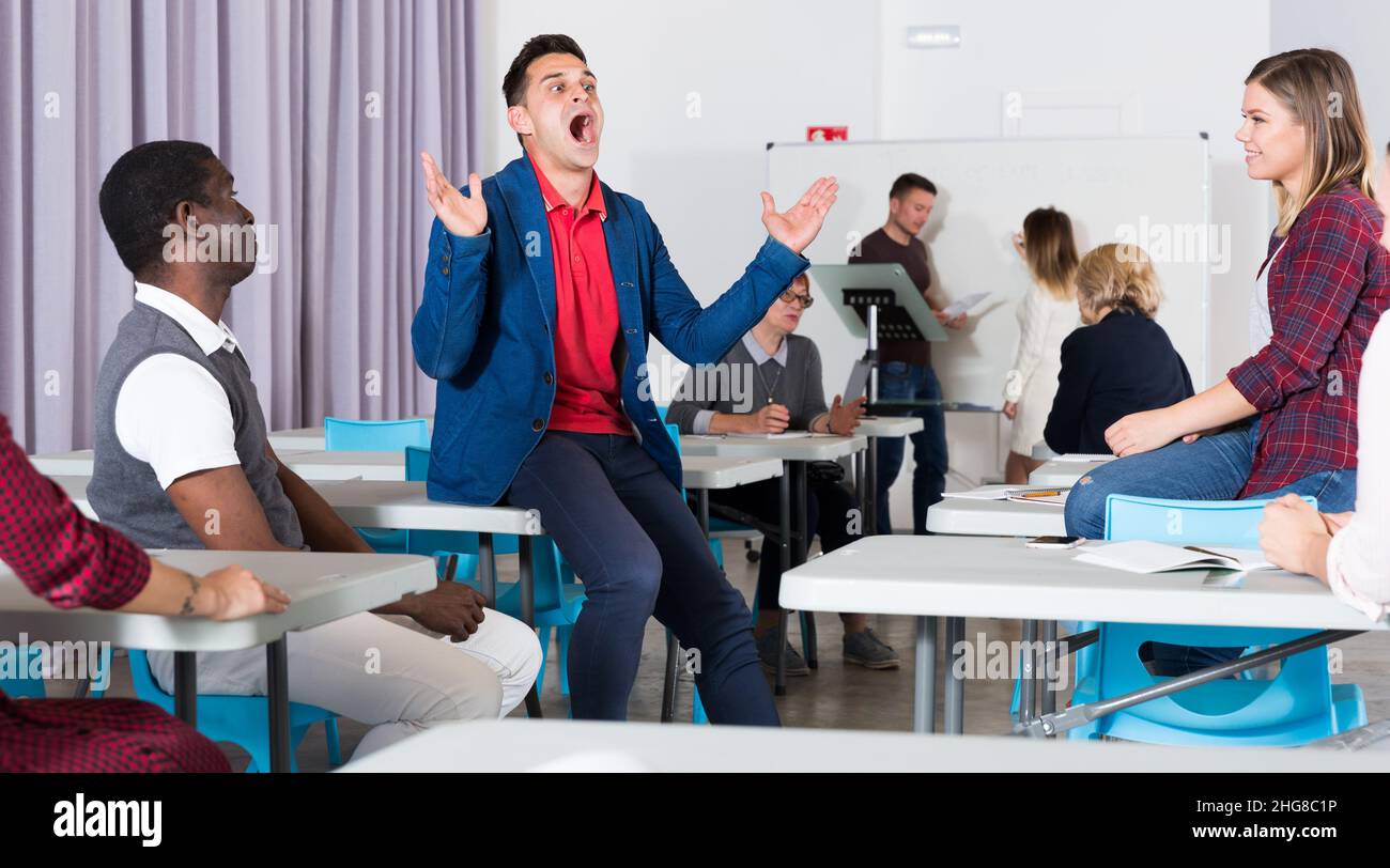 Adult students during recess Stock Photo - Alamy