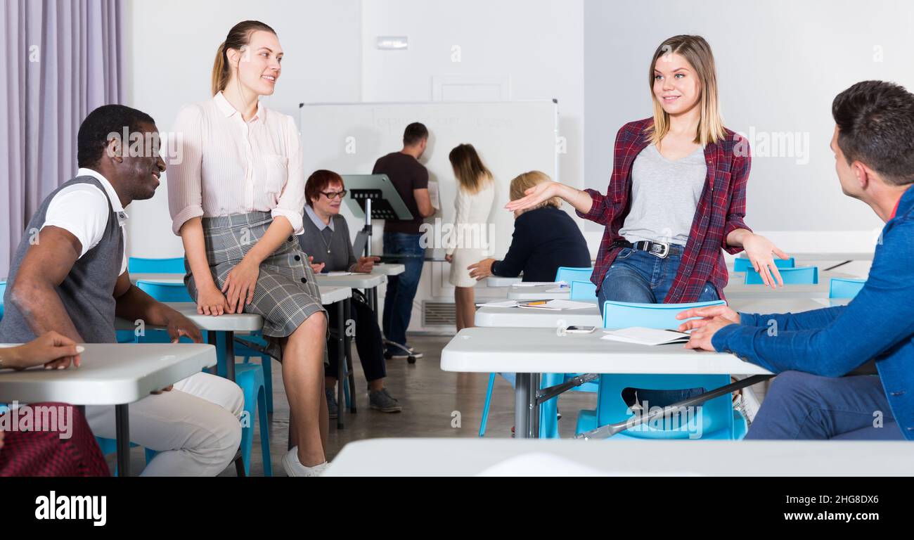Adult students during recess Stock Photo - Alamy