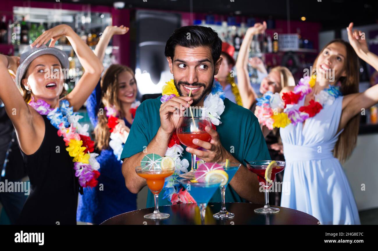 Man enjoying hawaiian party Stock Photo - Alamy