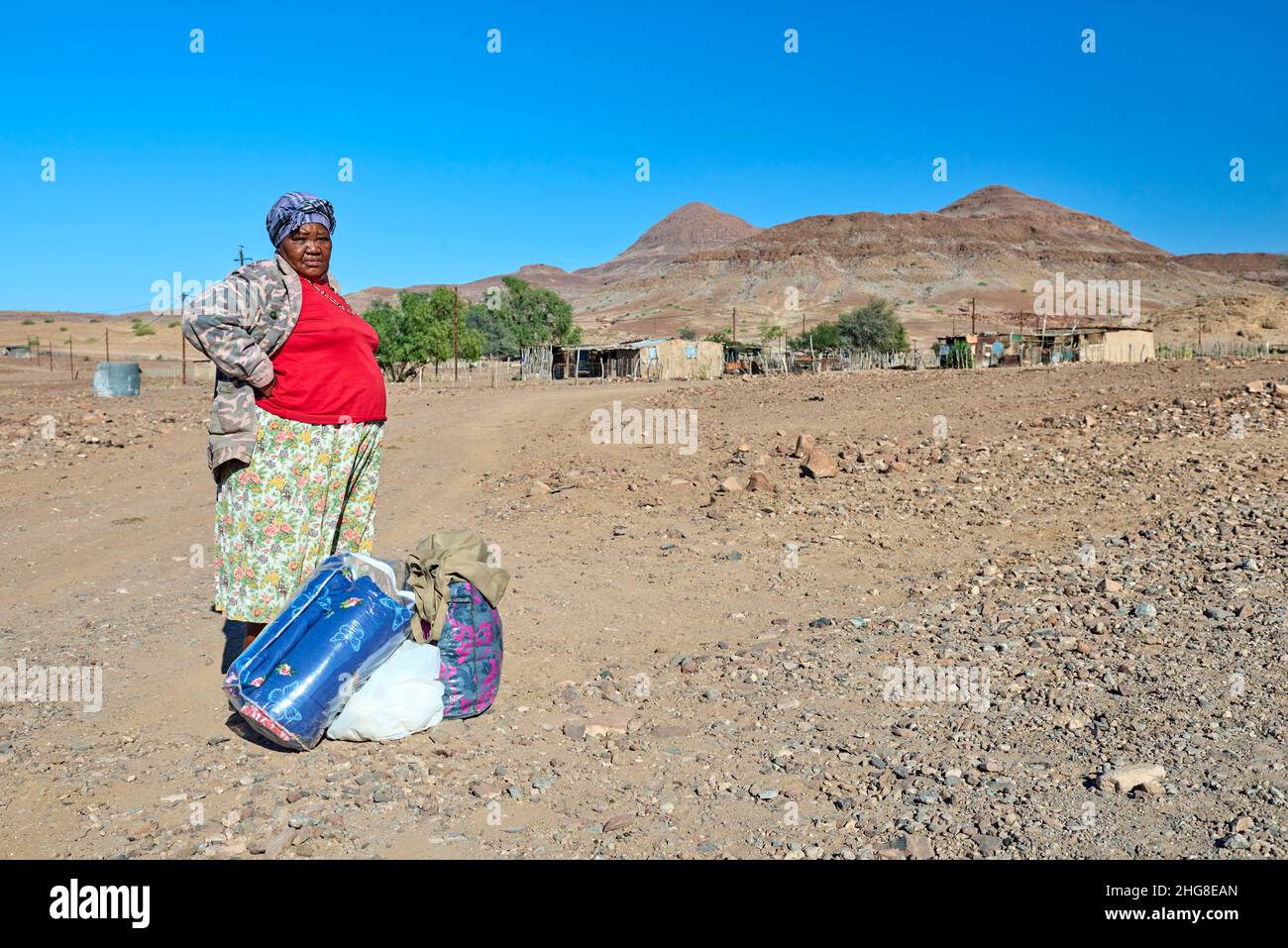 Woman carrying heavy bags hi-res stock photography and images - Alamy