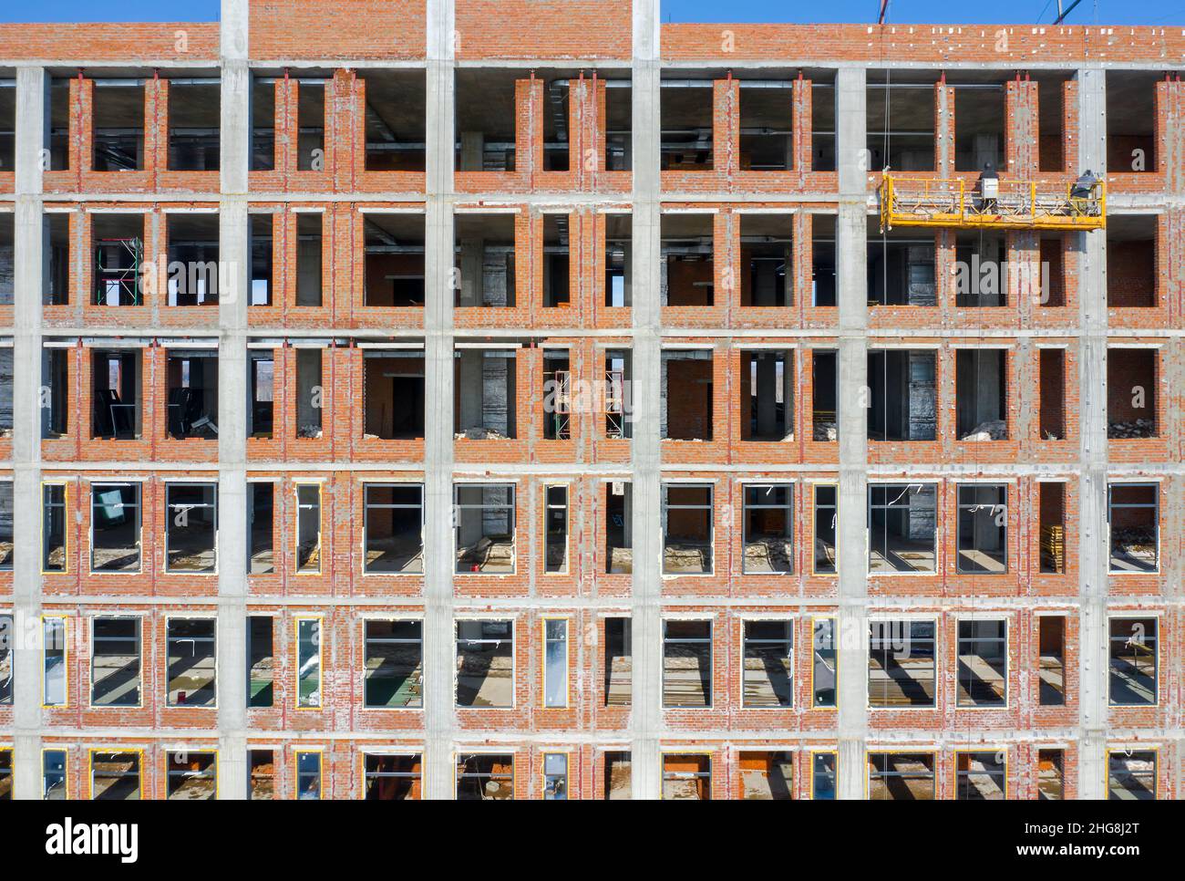 The wall of a multi-storey brick building under construction Stock ...