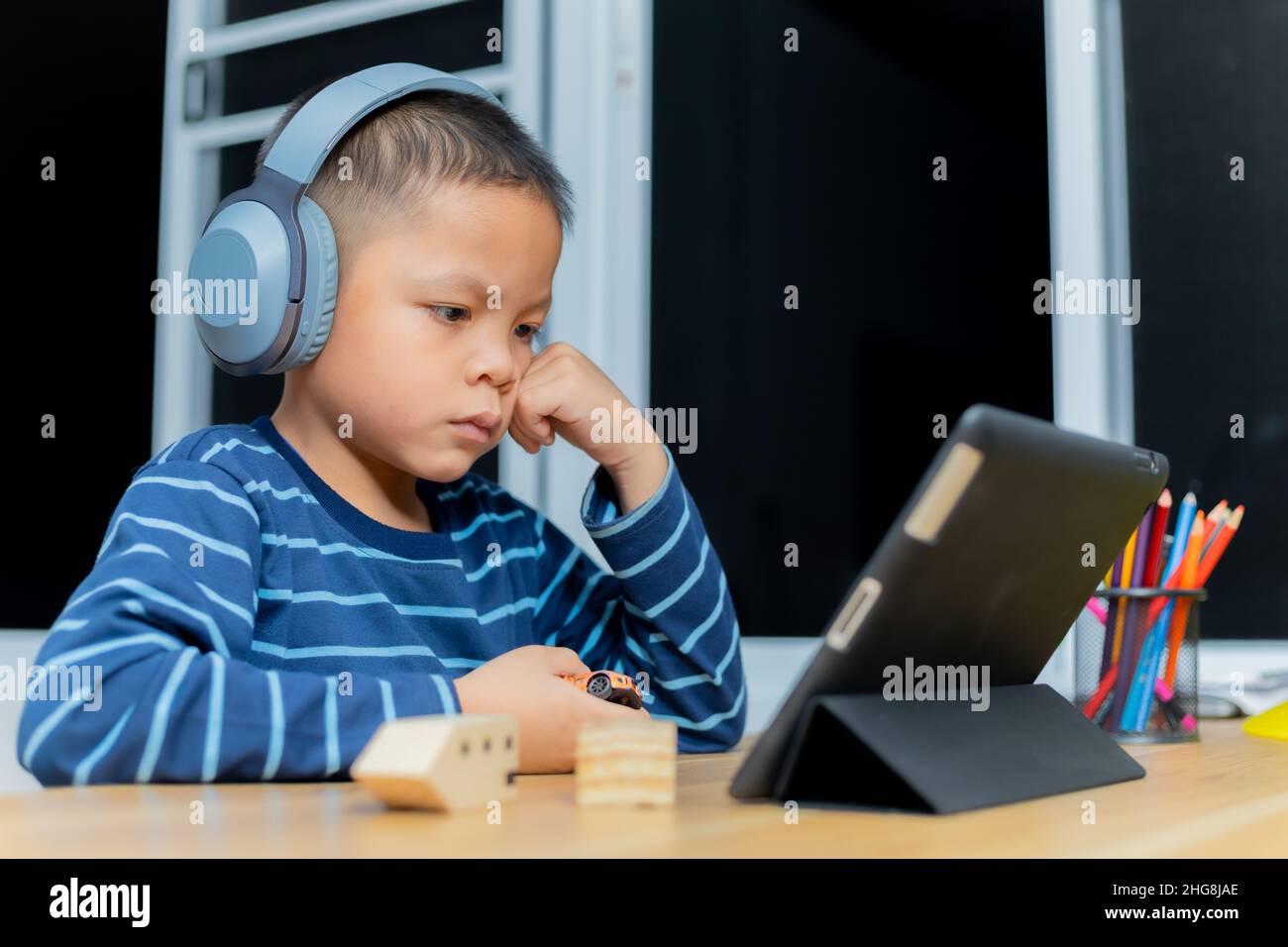 Children study online through tablets at home Stock Photo - Alamy