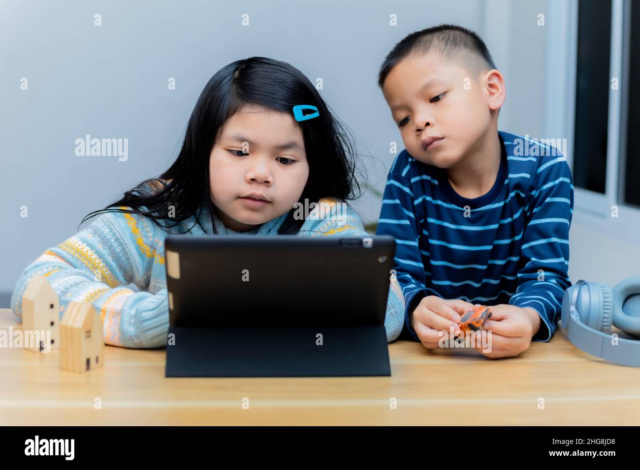 Children study online through tablets at home Stock Photo - Alamy