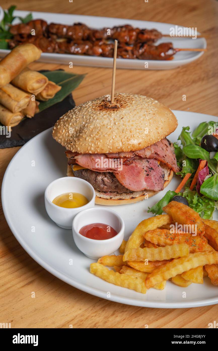 Variety of dishes on the restaurant table Stock Photo - Alamy