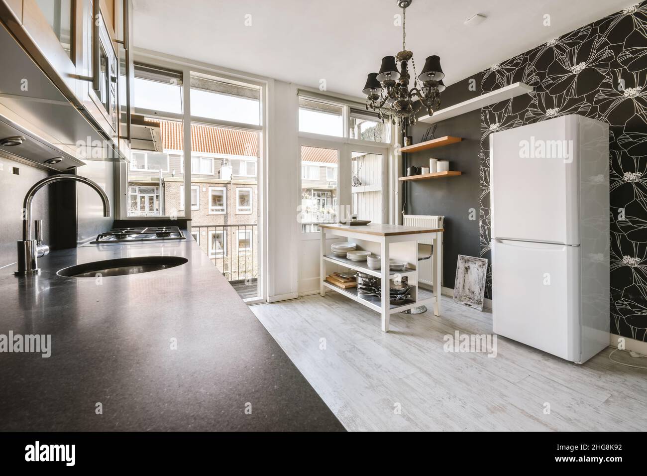 Mind-blowing stylish kitchen with wooden table and fridge Stock Photo ...
