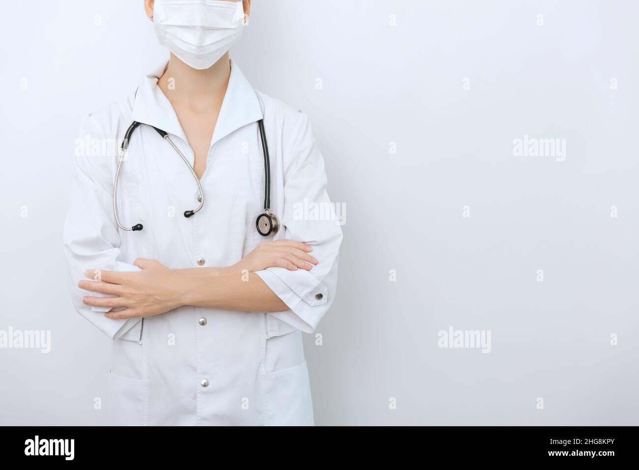 Doctor with stethoscope in medical coat on white background. Front ...