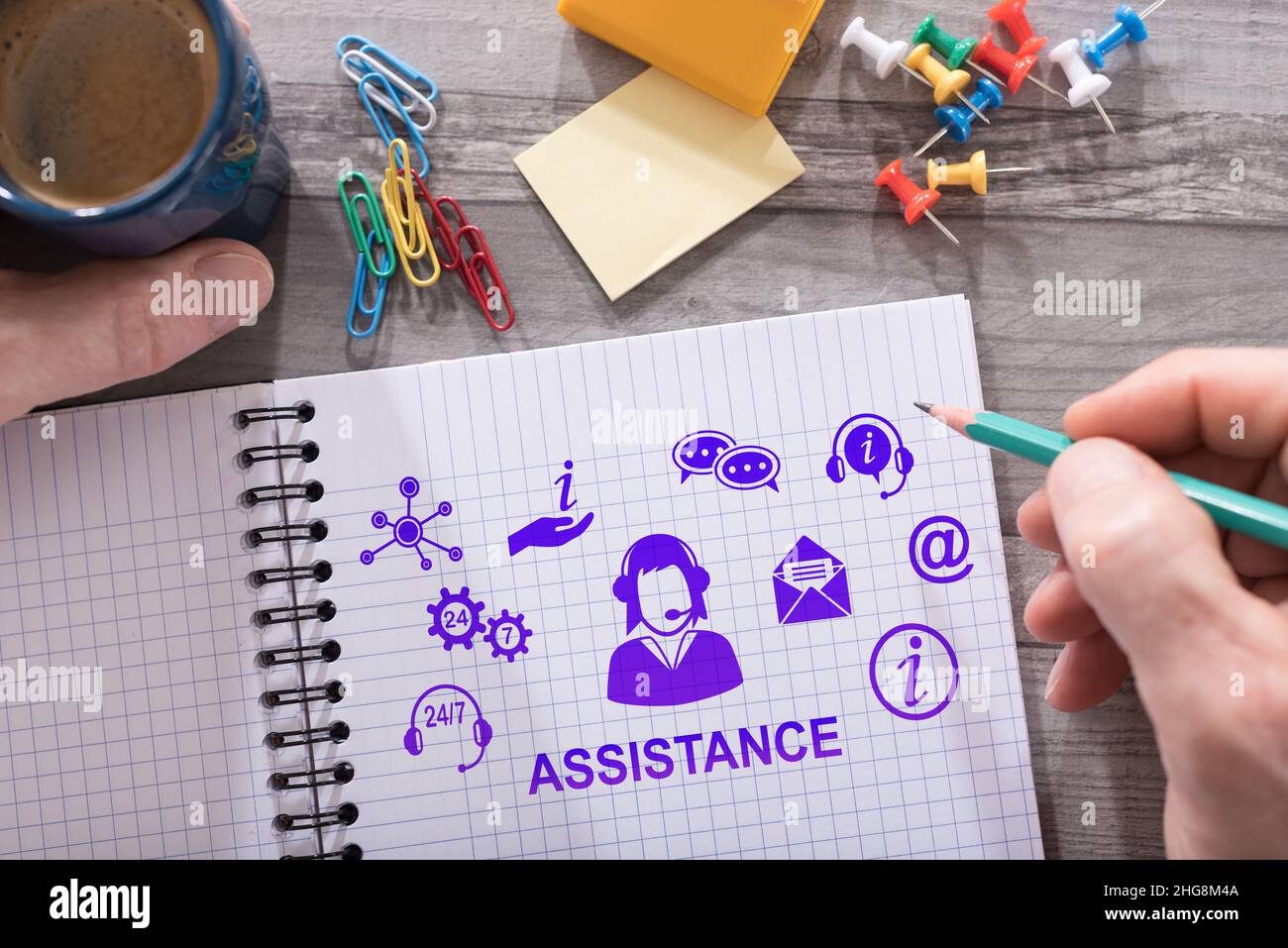 Assistance concept drawn on a notepad placed on a desk Stock Photo - Alamy