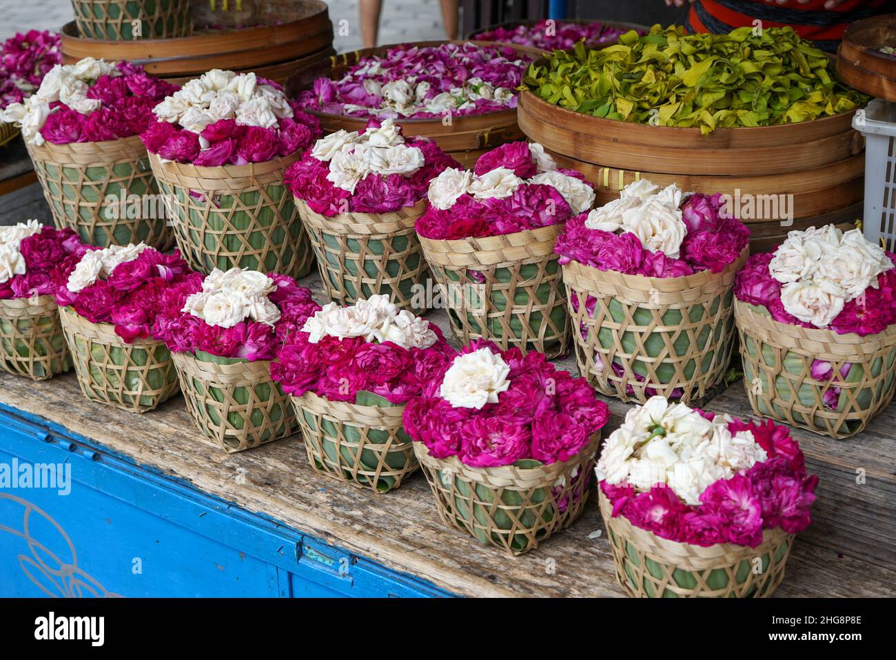 Tomb flowers for pilgrimage wrapped in banana leaves are sold on the ...